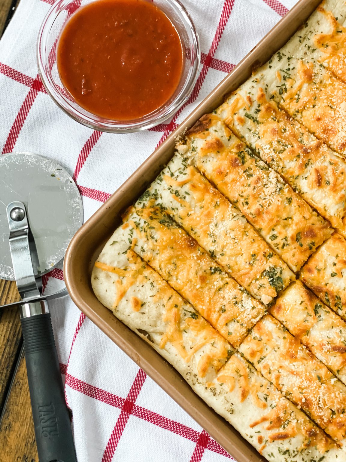 Cheesy Sheet Pan Breadsticks - Pound Dropper